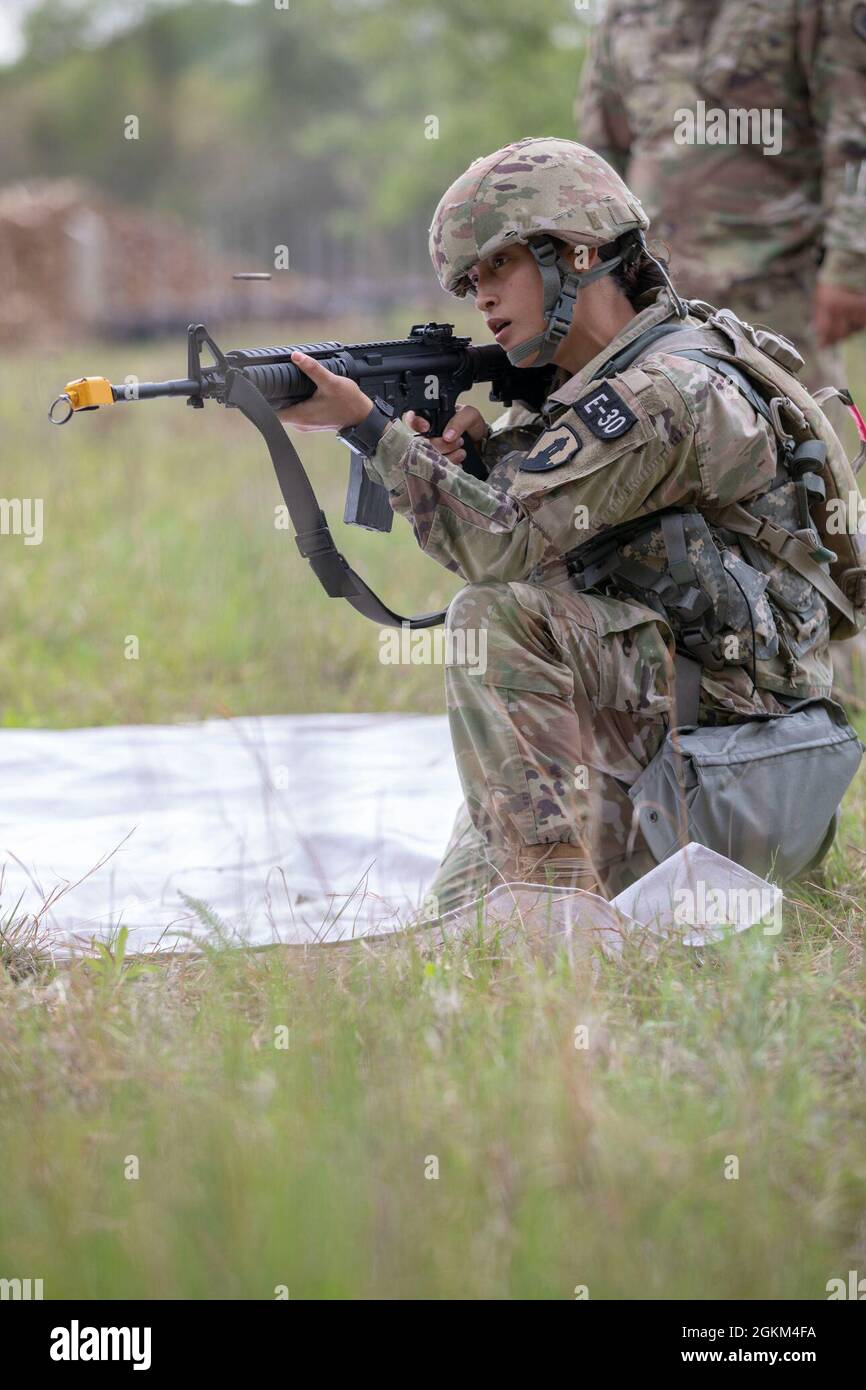 U.S. Army Reserve Soldier preforms a weapon function check with the M4 ...