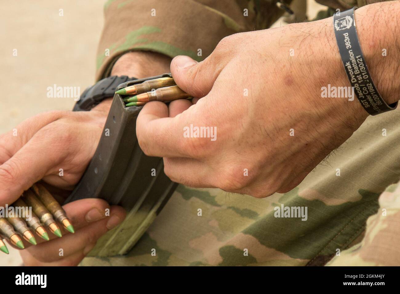 A U.S. Army Reserve Soldier loads 5.56 mm ammunition into an M4A1 ...