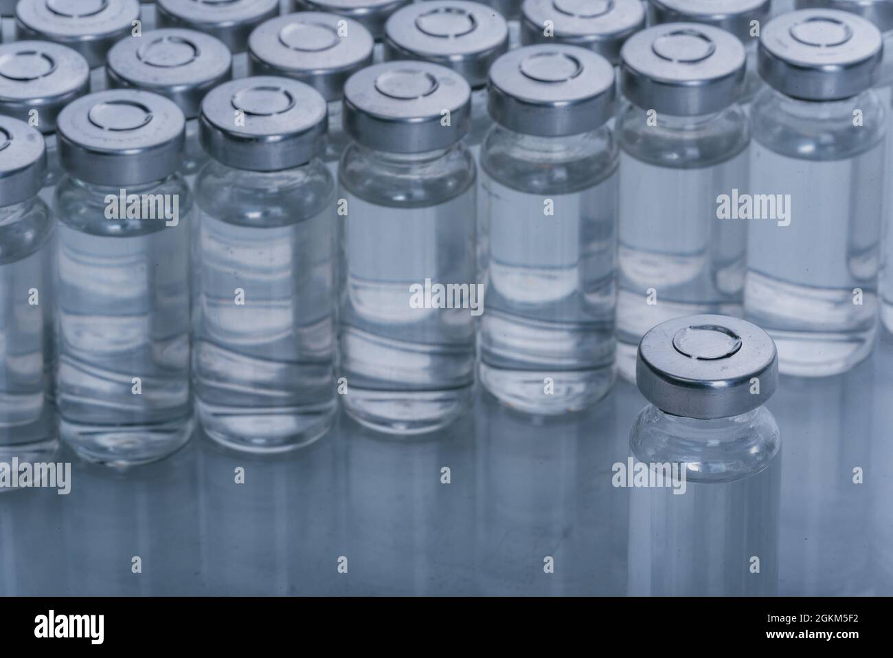 Glass medical ampoule vial for injection. Medicine is dry white drug ...