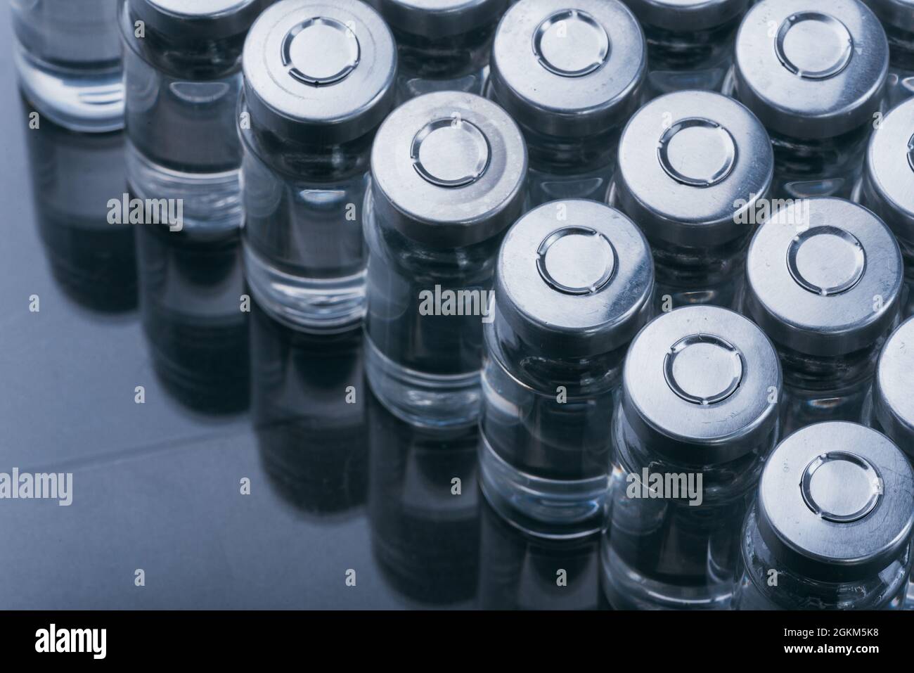 Glass medical ampoule vial for injection. Medicine is dry white drug ...