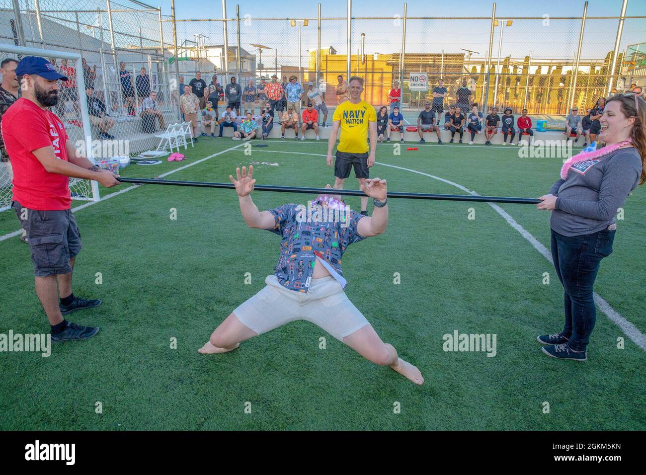 U.S. Active duty service members compete in a limbo competition for a ...