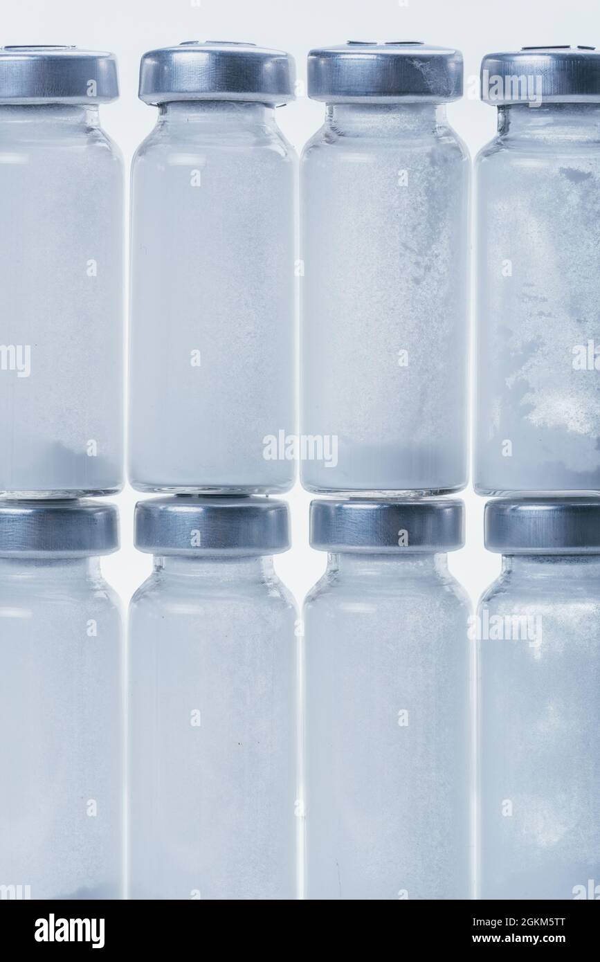 Glass medical ampoule vial for injection. Medicine is dry white drug ...