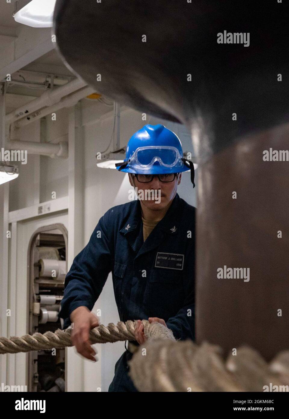 SAN DIEGO (May 23, 2021) Seaman Matthew Wallace heaves on a line from ...