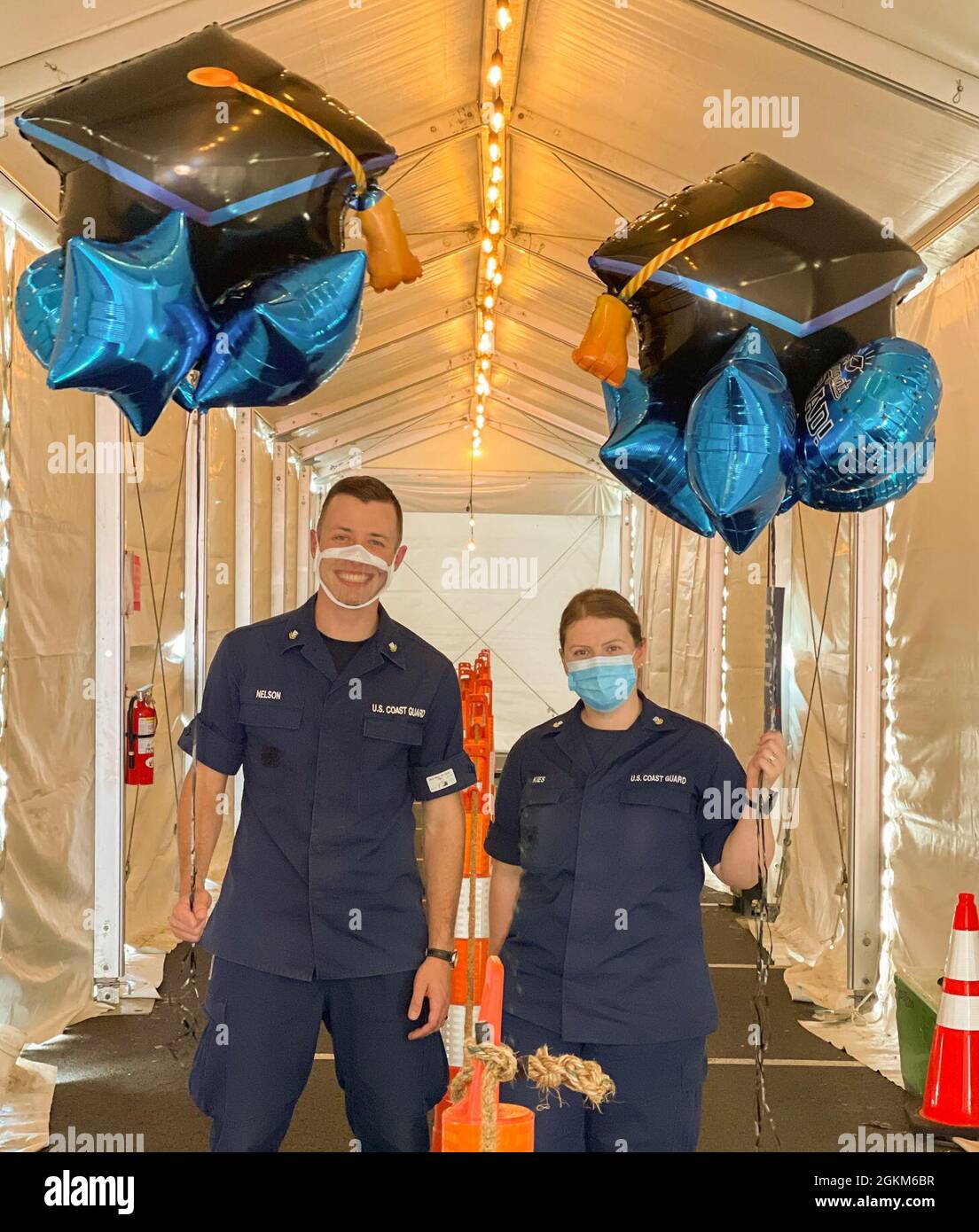 U.S. Coast Guard Petty Officer 2nd Class John Arthur Nelson, left, an ...