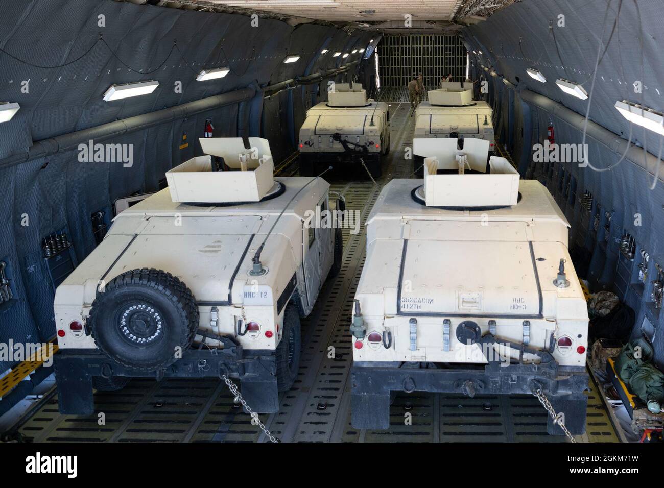 Humvees sit in a C-5M Super Galaxy during a Major Command Service Tail ...
