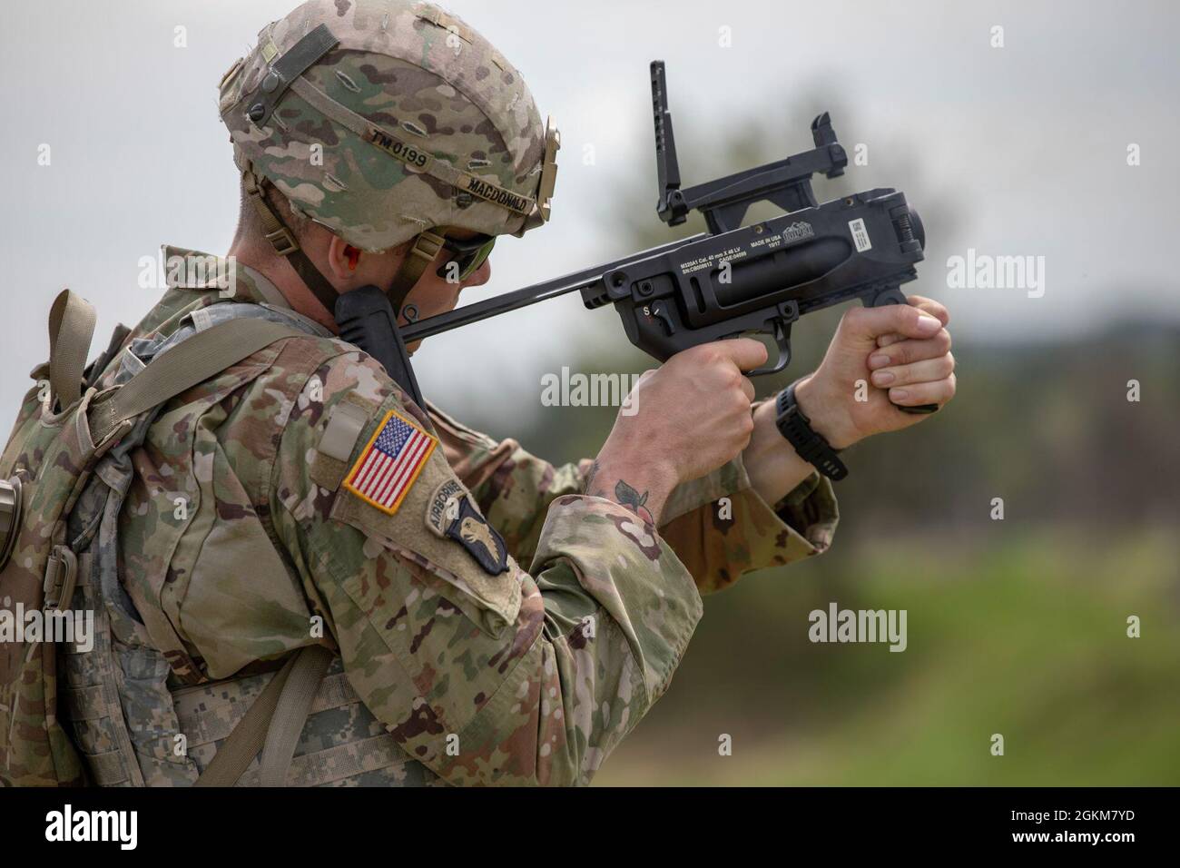 A U.S. Army Reserve Soldier aims the M320A1 Grenade Launcher in the kneeling position during the ...