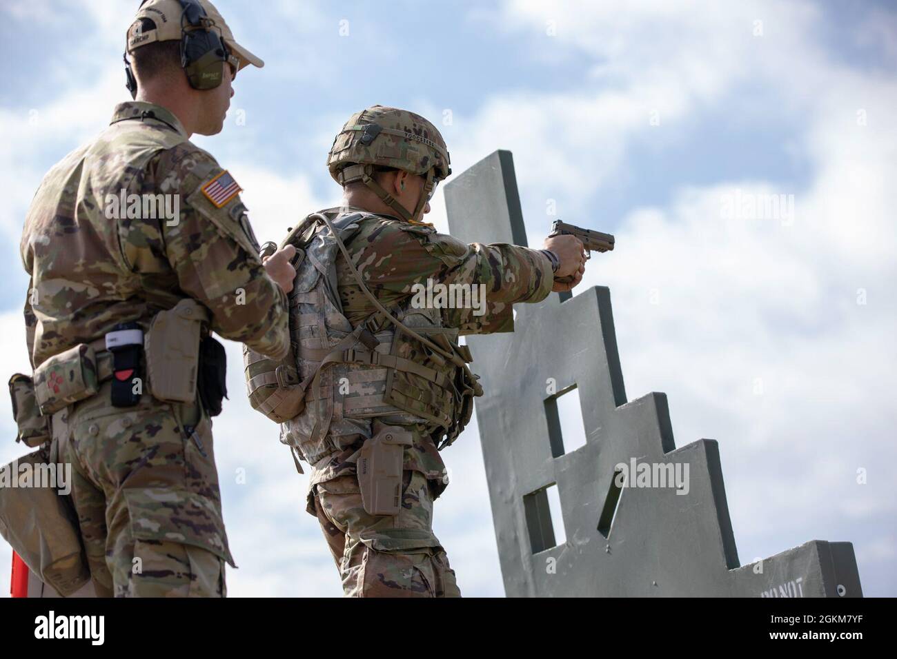 A U.S. Army Reserve Soldier fires the M17 Pistol during the Three Gun ...