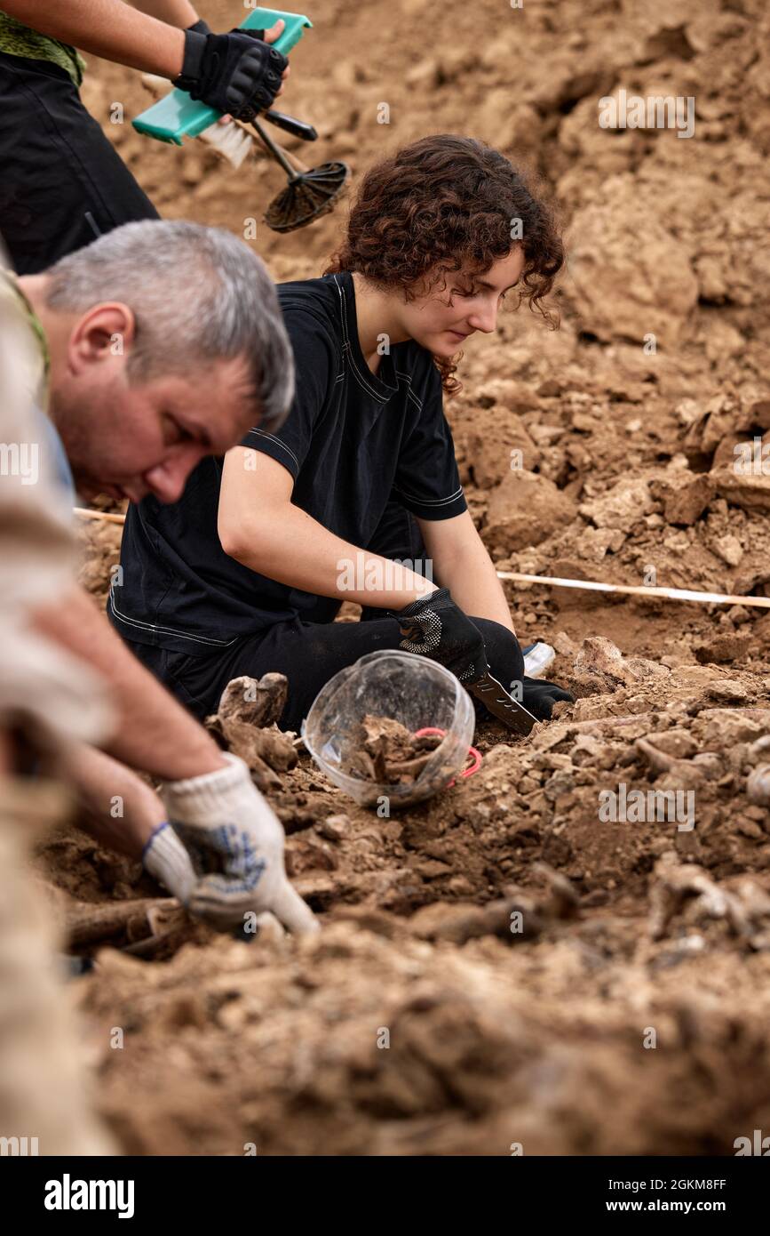 Excavations at the site of a war crime. Site of a mass shooting of ...