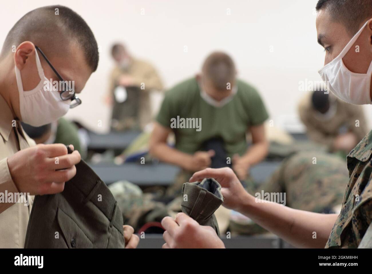 Recruits with India Company, 3rd Recruit Training Battalion, fold their ...