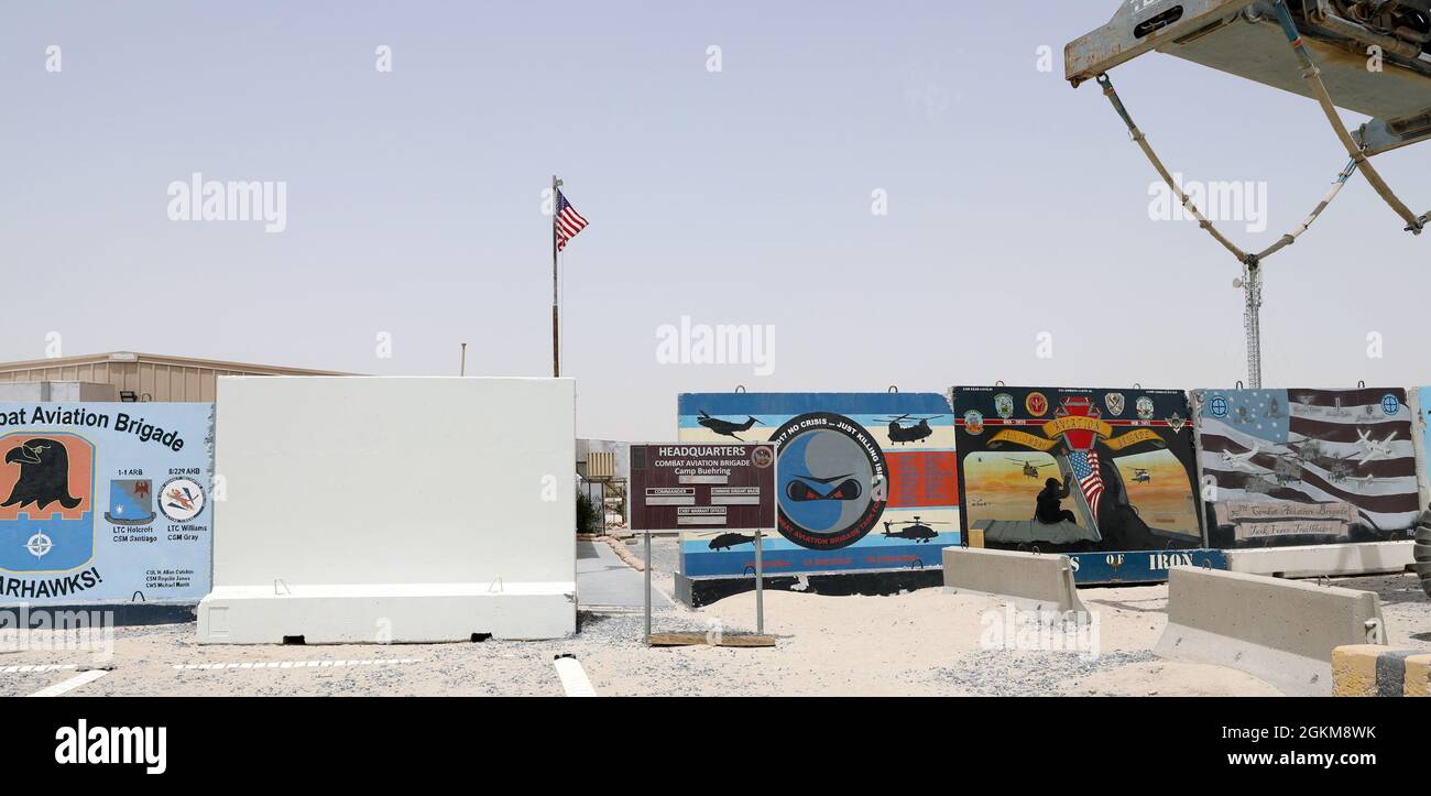 A blank T-wall stands in front of the Task Force Phoenix Tactical ...