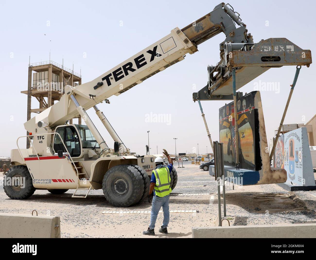 Contractors switch out a T-wall belonging to the 28th Expeditionary ...