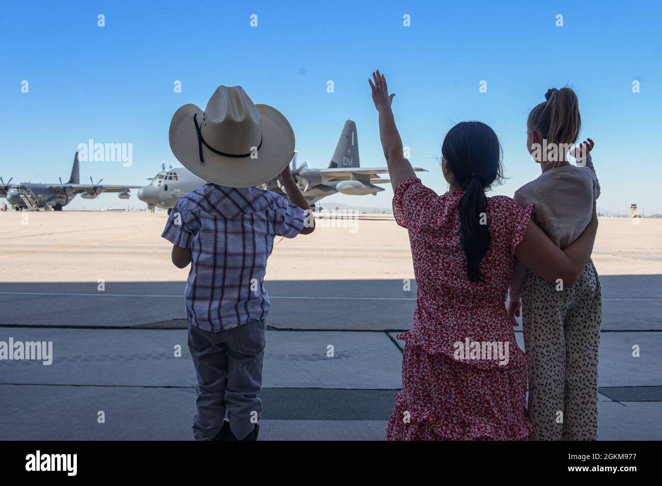 Families wave farewell on the flight line at Davis-Monthan Air Force ...