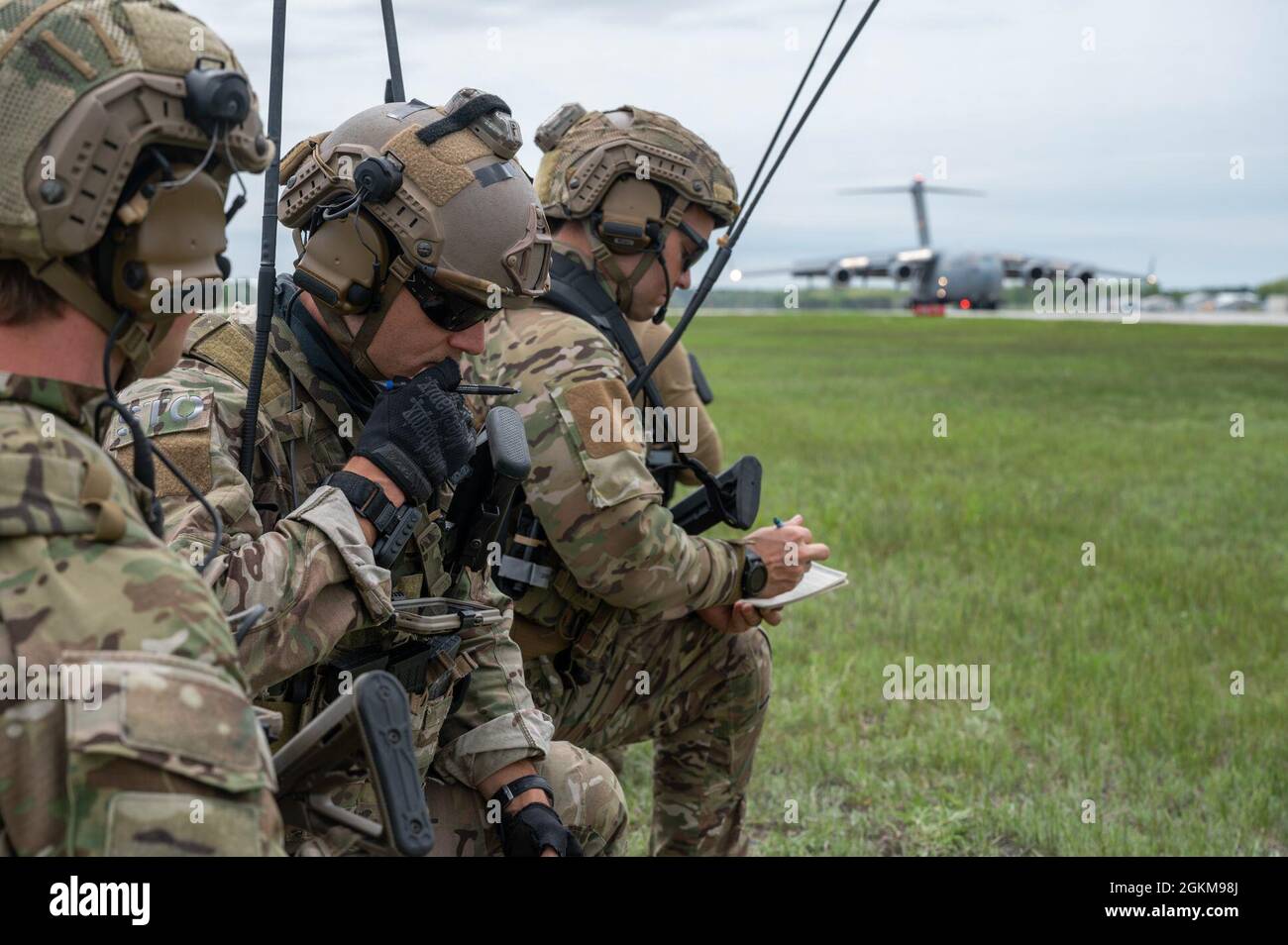 U.S. Air Force Special Tactics operators communicate with aircraft ...