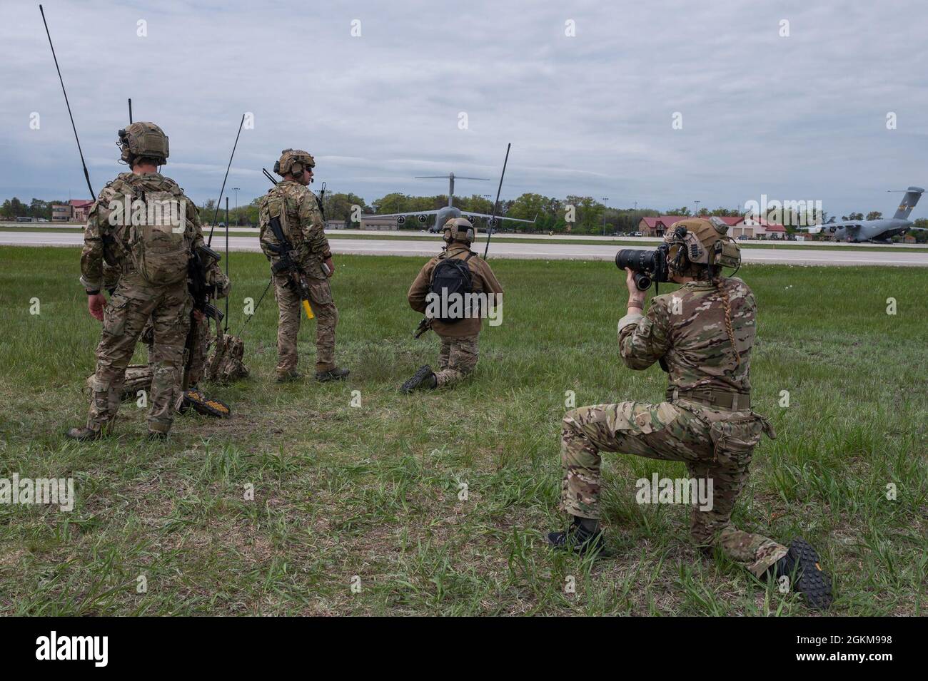 A U.S. Air Force combat photojournalist, 1st Combat Camera Squadron ...