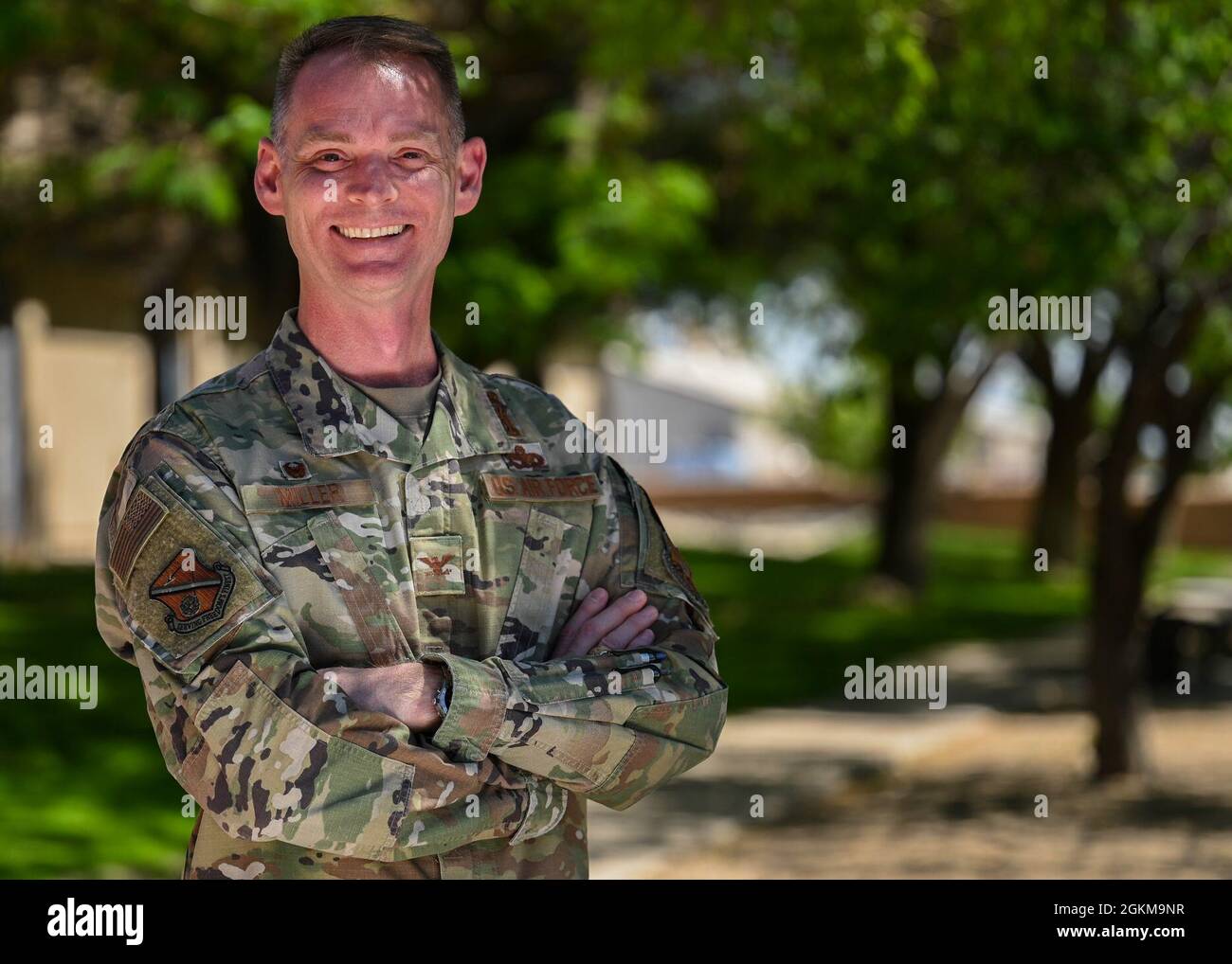 Col. David Miller poses in front of the 377th Air Base Wings ...