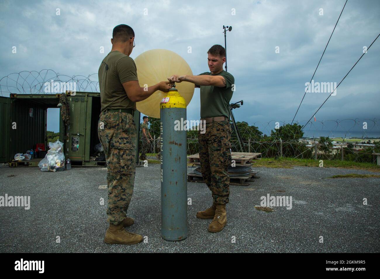 U.S. Marine Corps Cpl. Tim Roberts, a Meteorological and Oceanographic ...