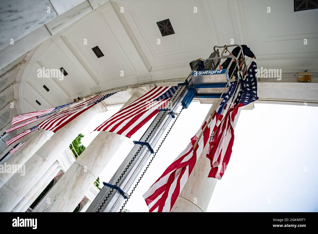 ANC Facilities Maintenance employees hang U.S. flags in the Memorial ...