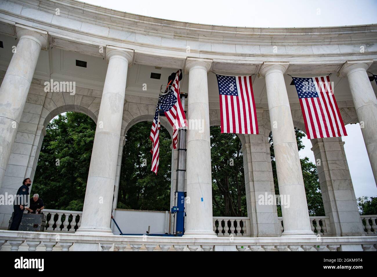 ANC Facilities Maintenance employees hang U.S. flags in the Memorial ...
