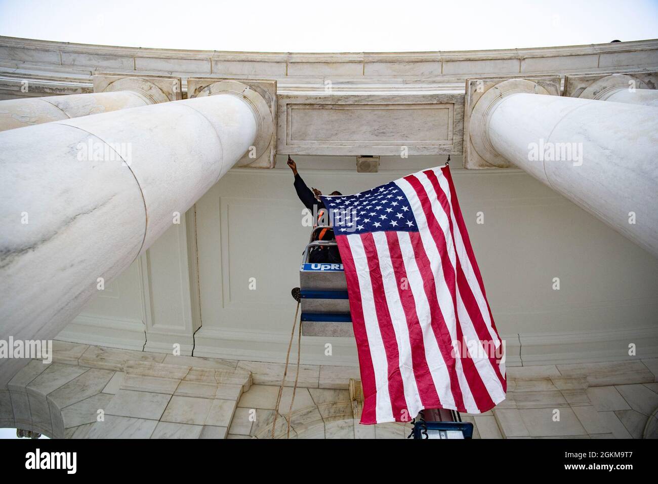 ANC Facilities Maintenance employees hang U.S. flags in the Memorial ...