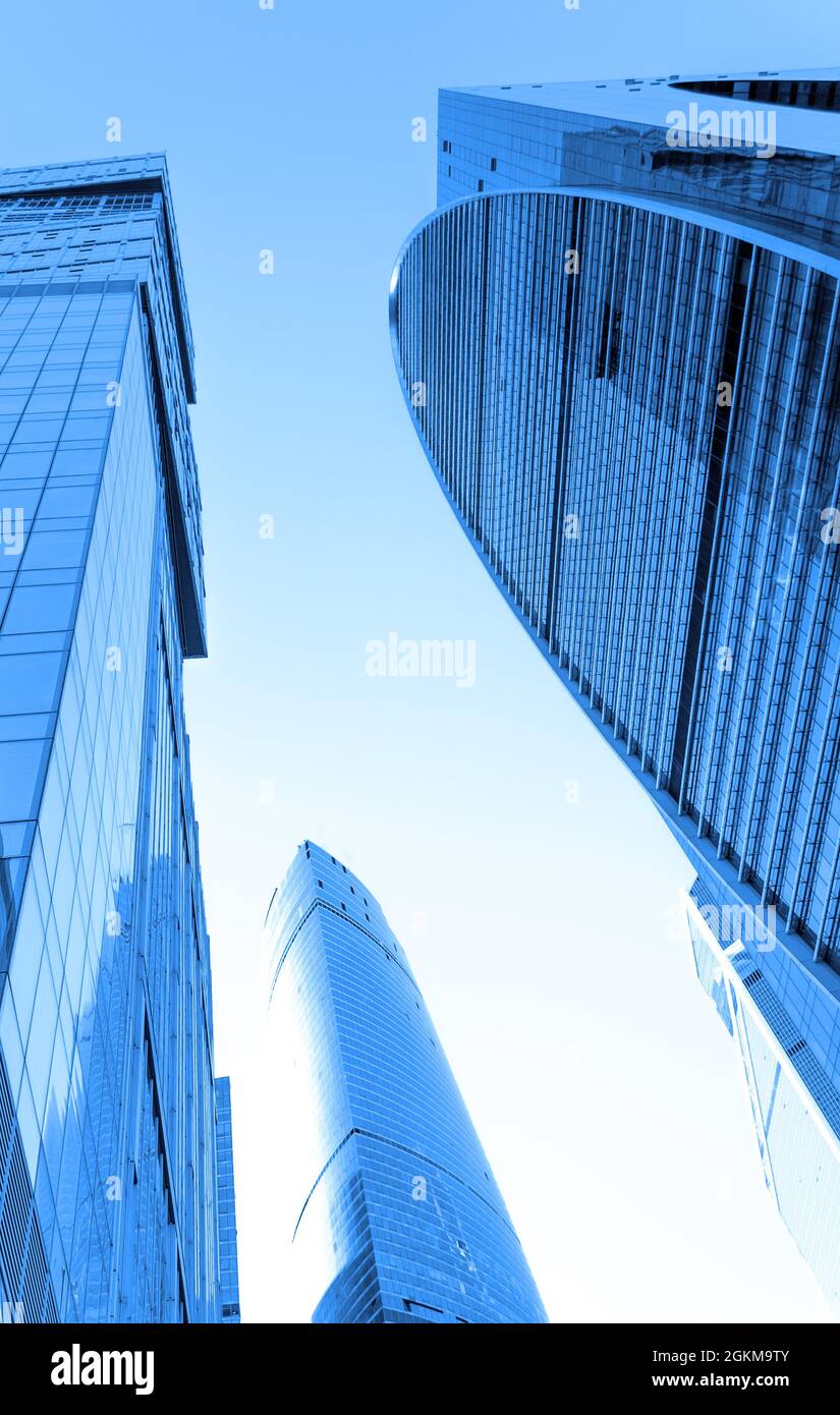 Perspective wide angle view to steel light blue glass surface, building ...