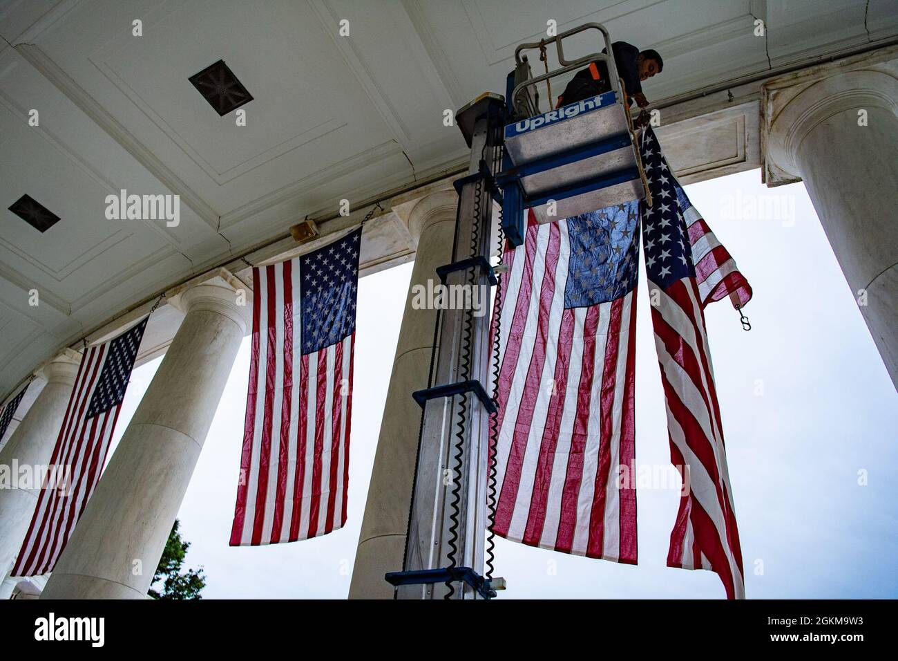 ANC Facilities Maintenance employees hang U.S. flags in the Memorial ...
