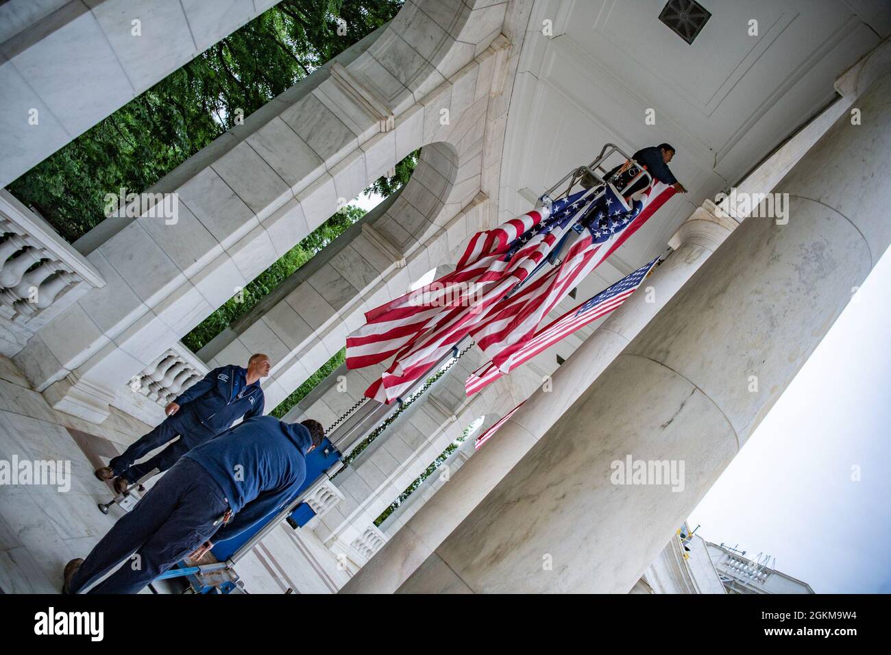 ANC Facilities Maintenance employees hang U.S. flags in the Memorial ...