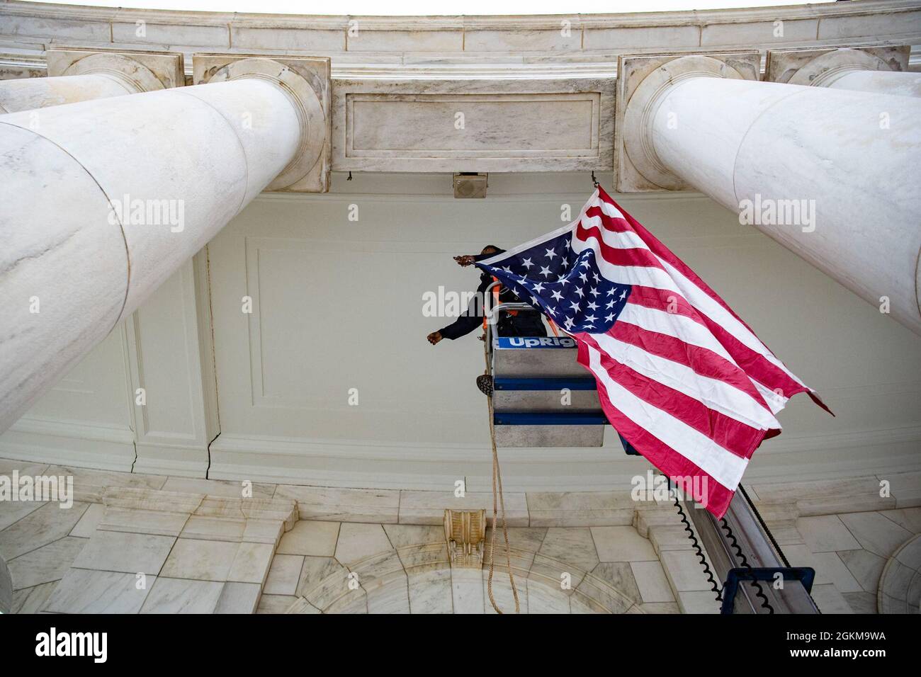 ANC Facilities Maintenance employees hang U.S. flags in the Memorial ...