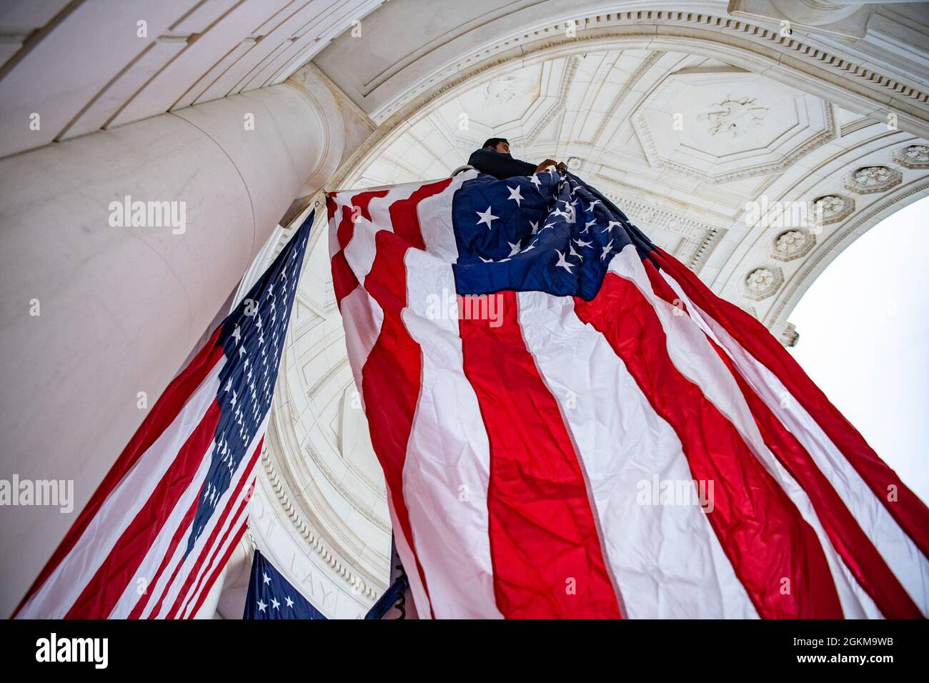 ANC Facilities Maintenance employees hang U.S. flags in the Memorial ...