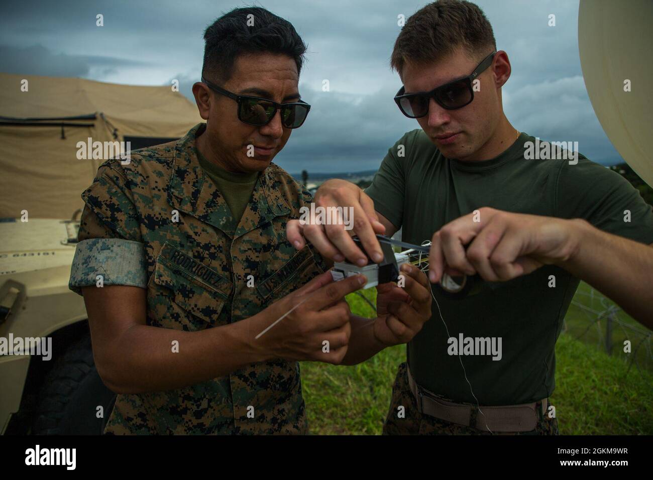 U.S. Marine Corps Cpl. Tim Roberts, a Meteorological and Oceanographic ...