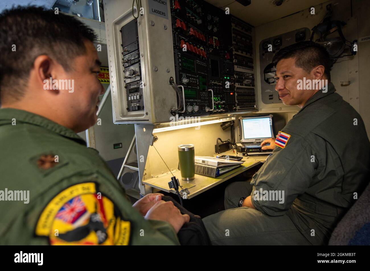 Maj. Skip Saito, 204th Airlift Squadron pilot, and Tech. Sgt. Josh ...