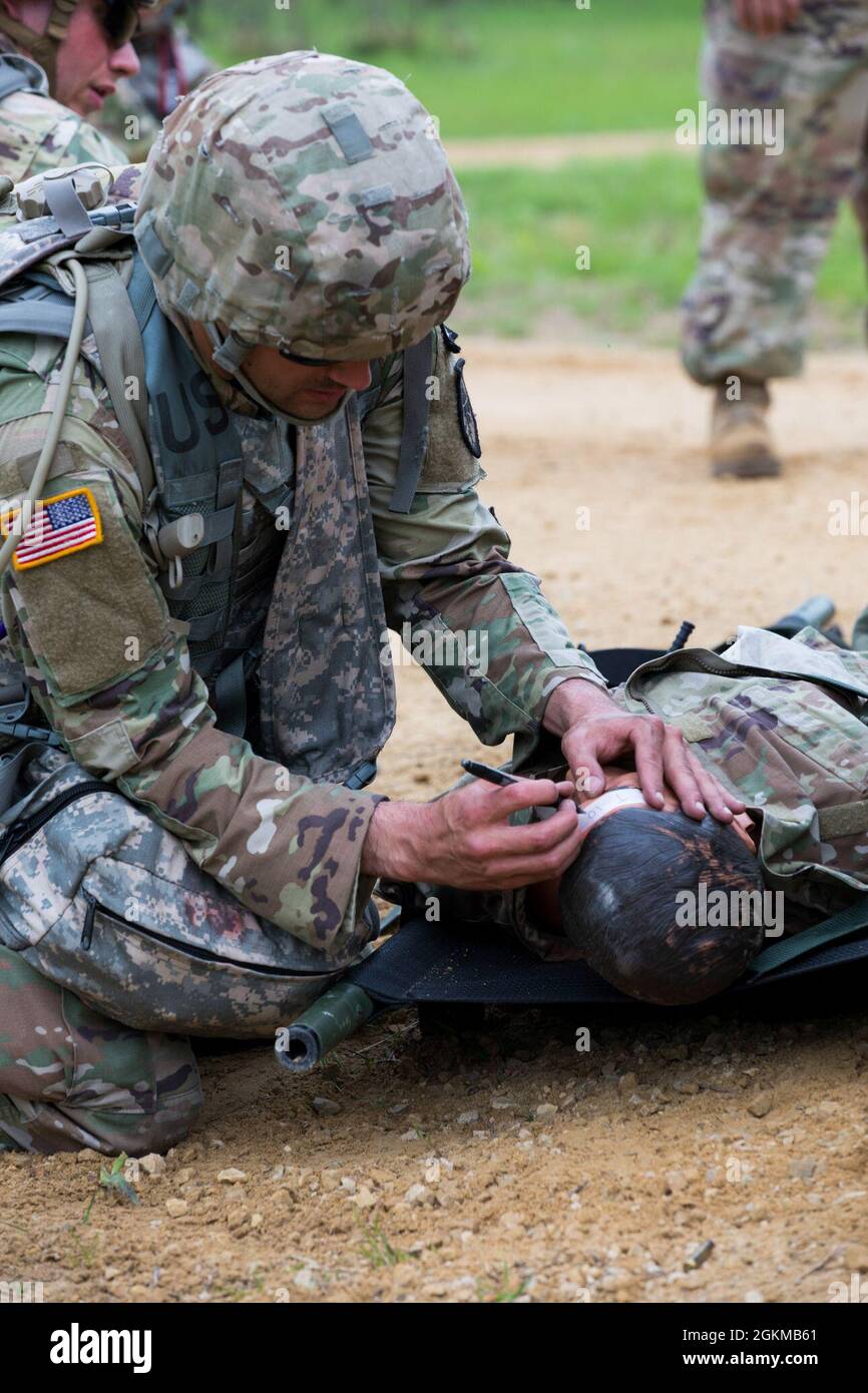 Spc. Karhal Wayman, from the Military Intelligence Command, records a ...
