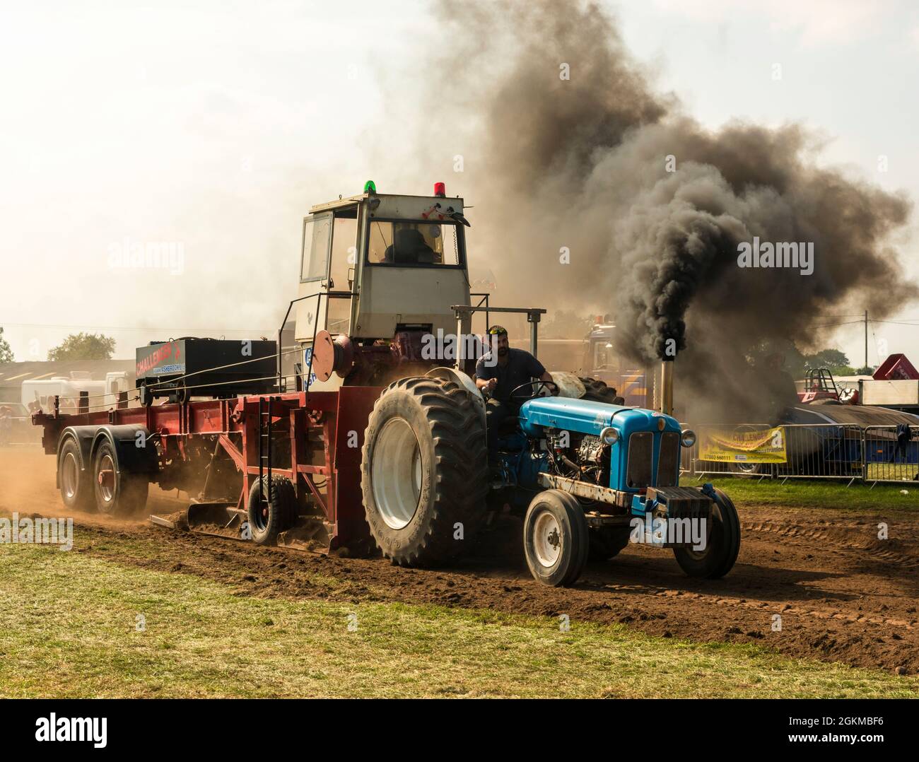 Tractor pulling contest showing huge exhaust fumes at a steam rally in ...