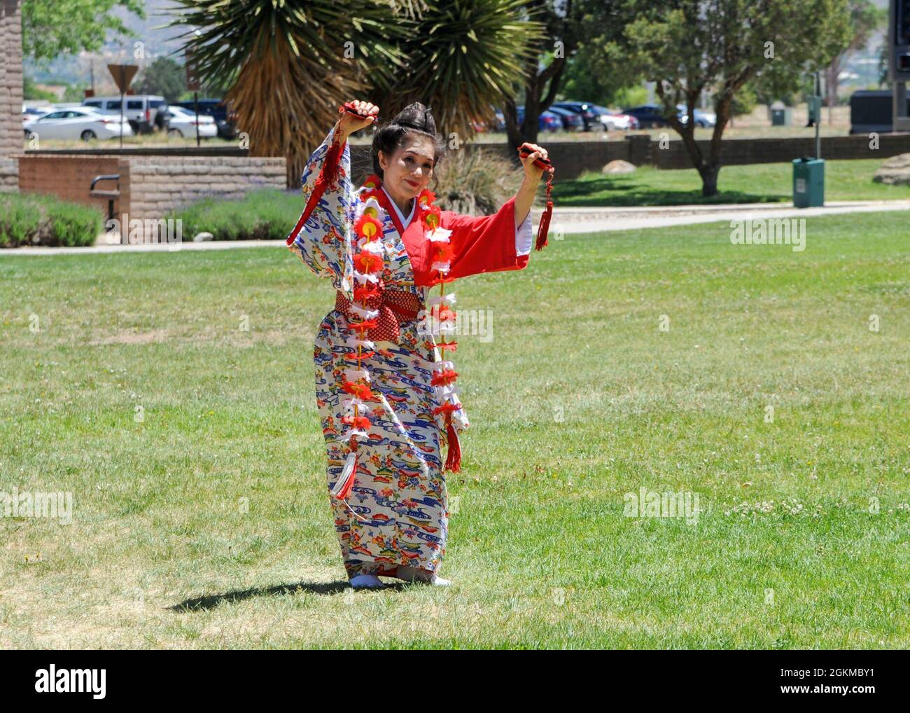 A member of the Miyagi Ryu Nosho Kai Ryukyu Dance School performs a ...