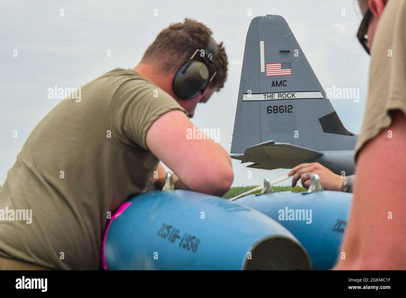 An Airman from the 354th Aircraft Maintenance Unit preps munitions for ...