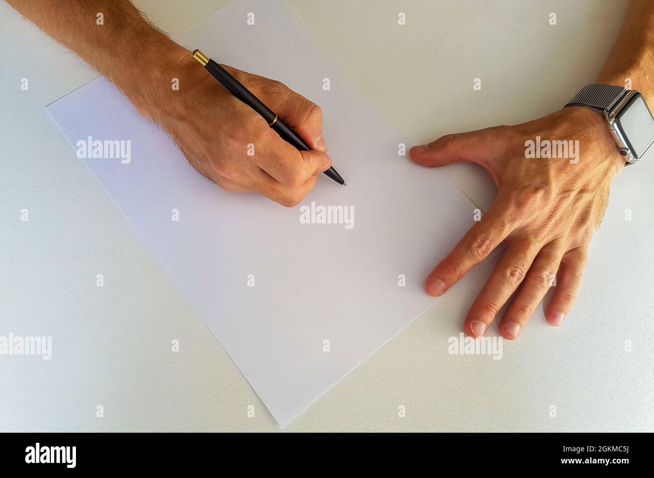 Businessman male writing a letter at his desk Stock Photo - Alamy