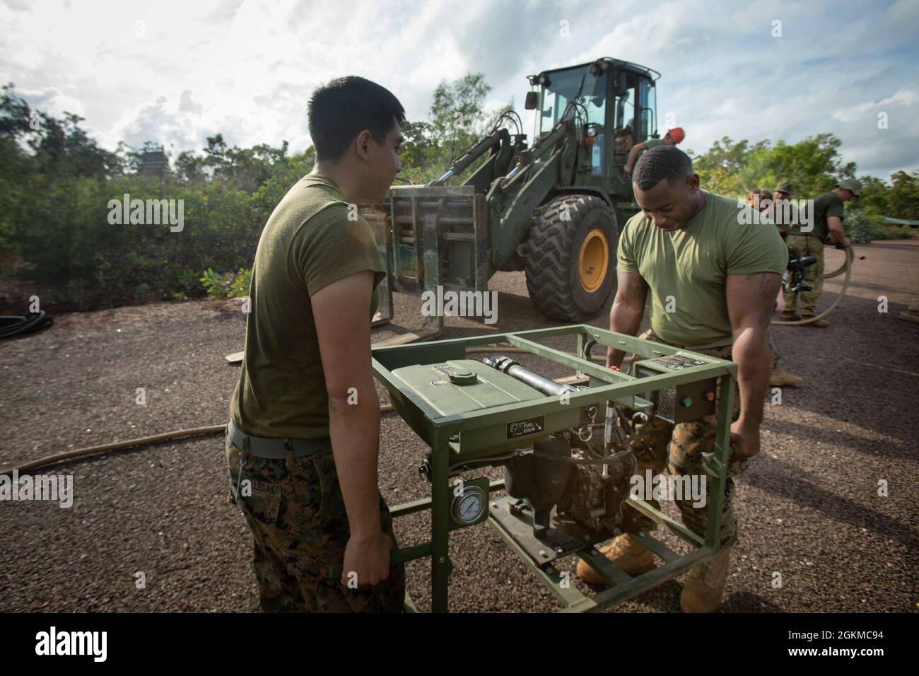 U.S. Marine Corps Lance Cpl. Jerry GarciaVillegas, left, a water ...