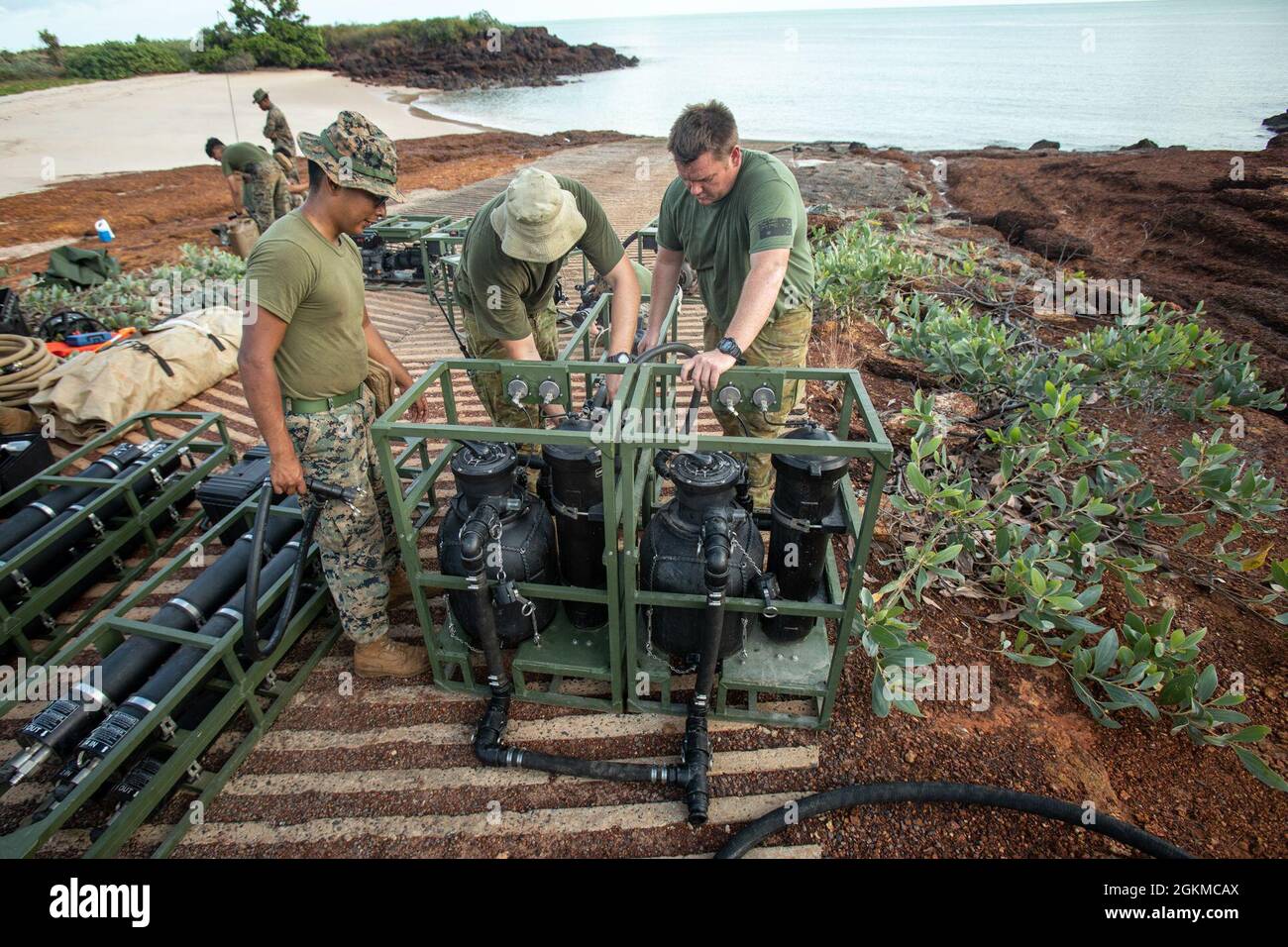 U.S. Marine Corps Lance Cpl. Jose MartinezLopez, left, a water support ...