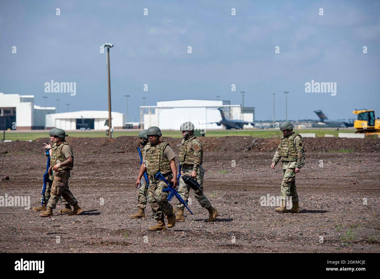 U.S. Air Force Airmen of the 97th Civil Engineer Squadron walk through ...