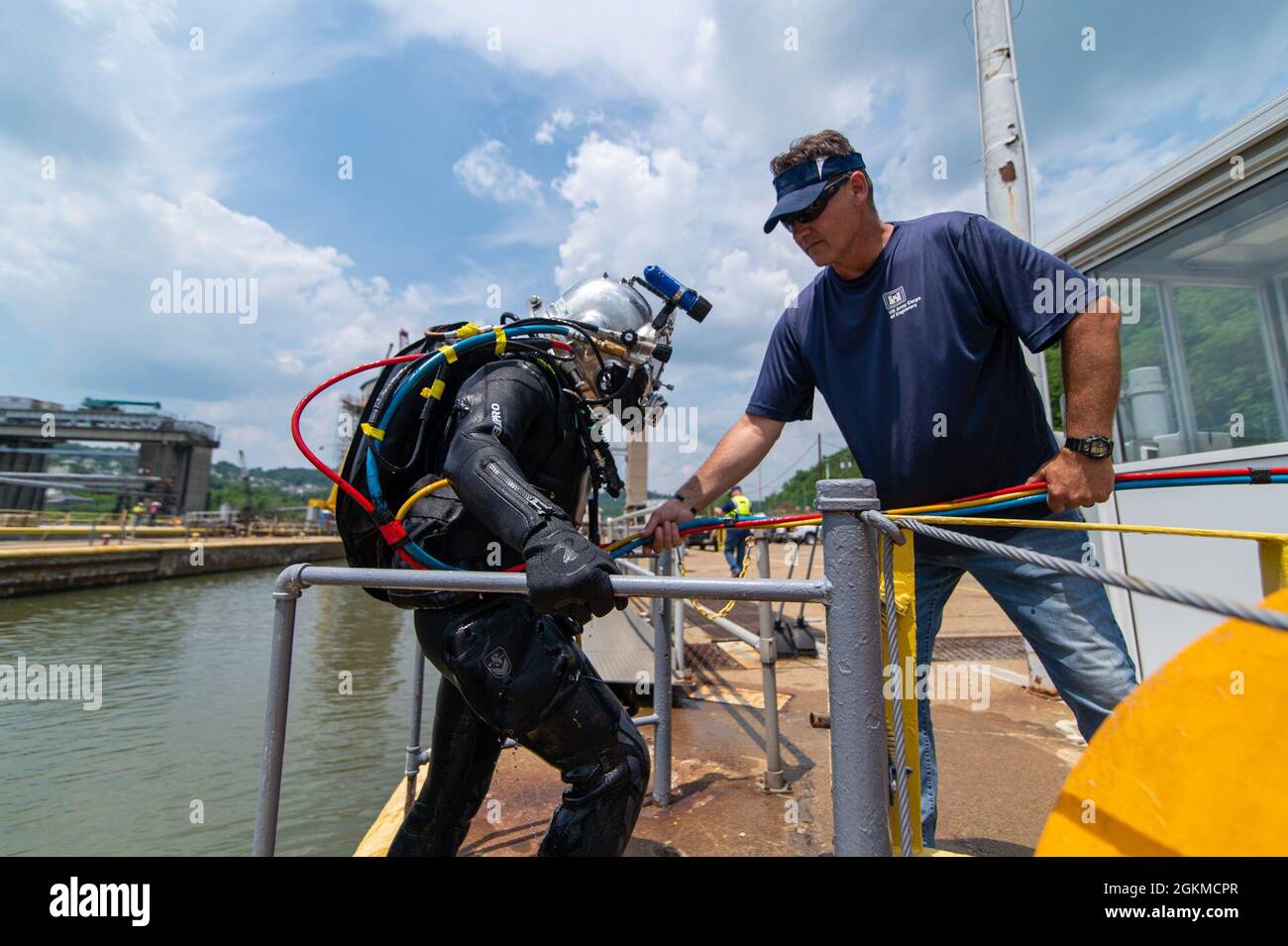 Teammates help Josh Lesch, a diver with the U.S. Army Corps of ...