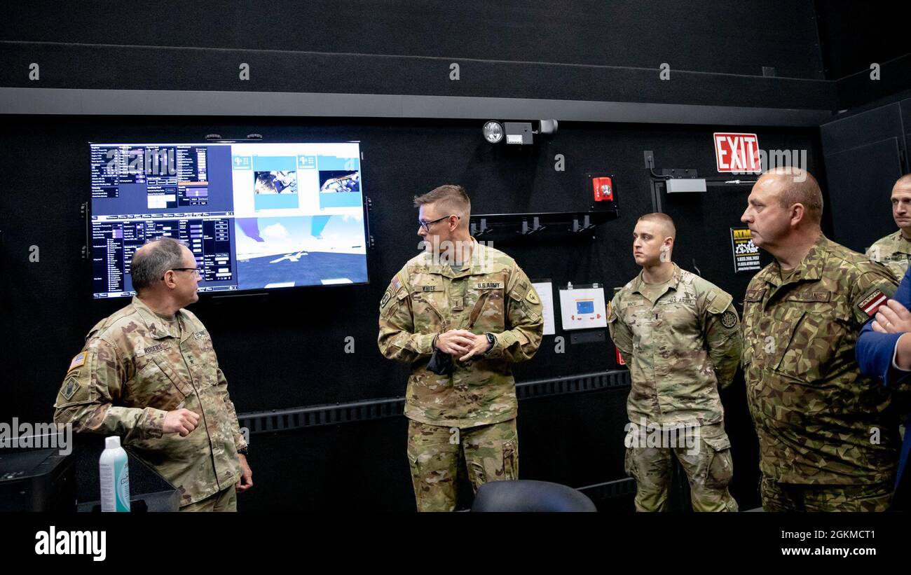 U.S. Army Chief Warrant Officer 3 Nick White, center, assigned to the ...