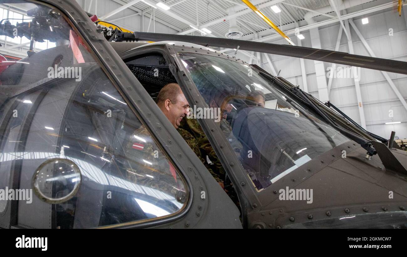 Latvian National Armed Forces Maj. Gen. Andis Dilāns, left, defense ...