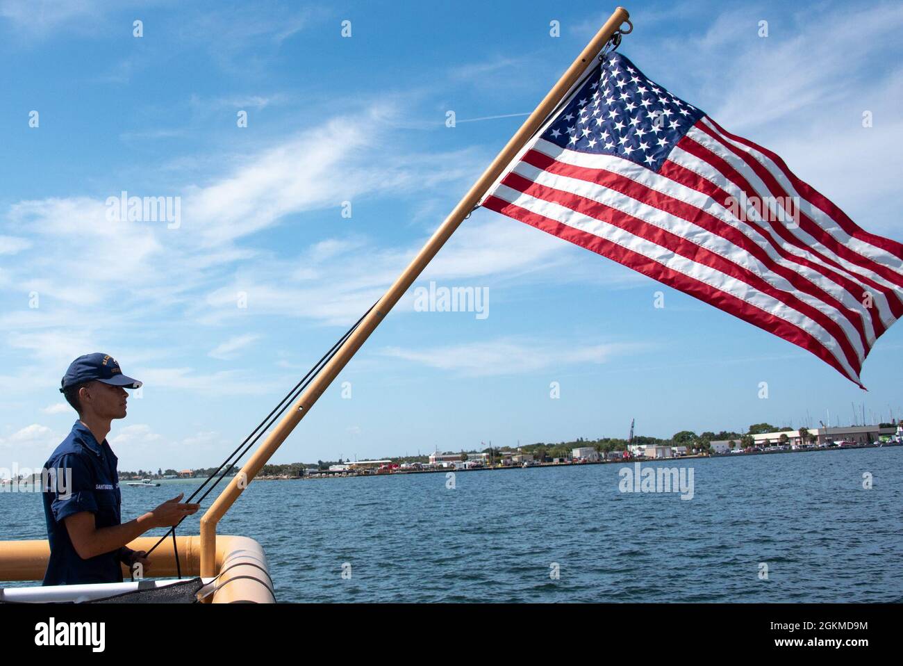 Coast Guard Seaman Rafael Santiago Castro posts the National Ensign on ...
