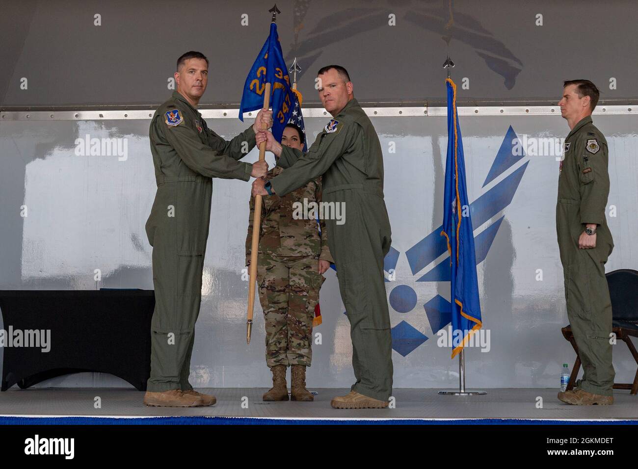 U.S. Air Force Col. Dan Walls, left, 23d Wing commander, passes a guidon to Col. Chris ...