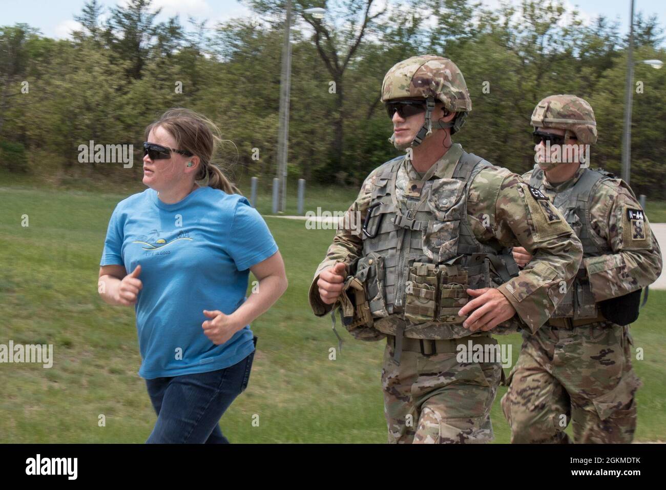 Spc. Omid Skinner (center) and Sgt. Jacob Harrison, U.S. Army Reserve ...