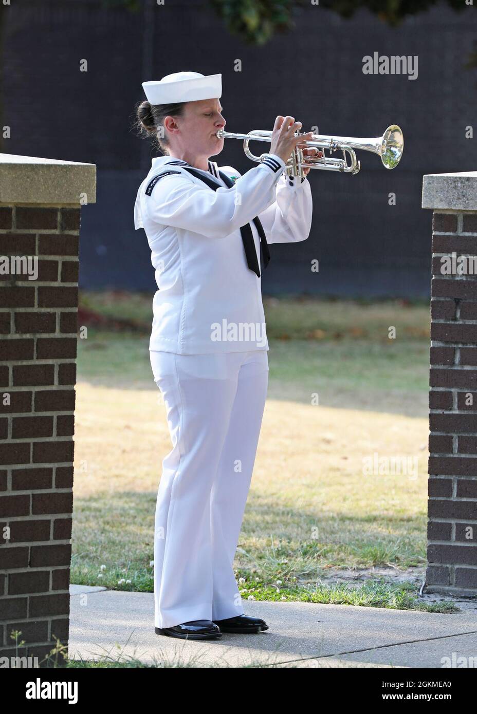 A bugler with the U.S. Fleet Forces Ceremonial Band performs Taps ...