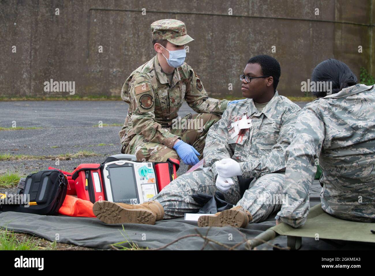 U.S. Air Force Maj. Daniel Hurtt, 423rd Medical Squadron family medicine physician, treats a ...