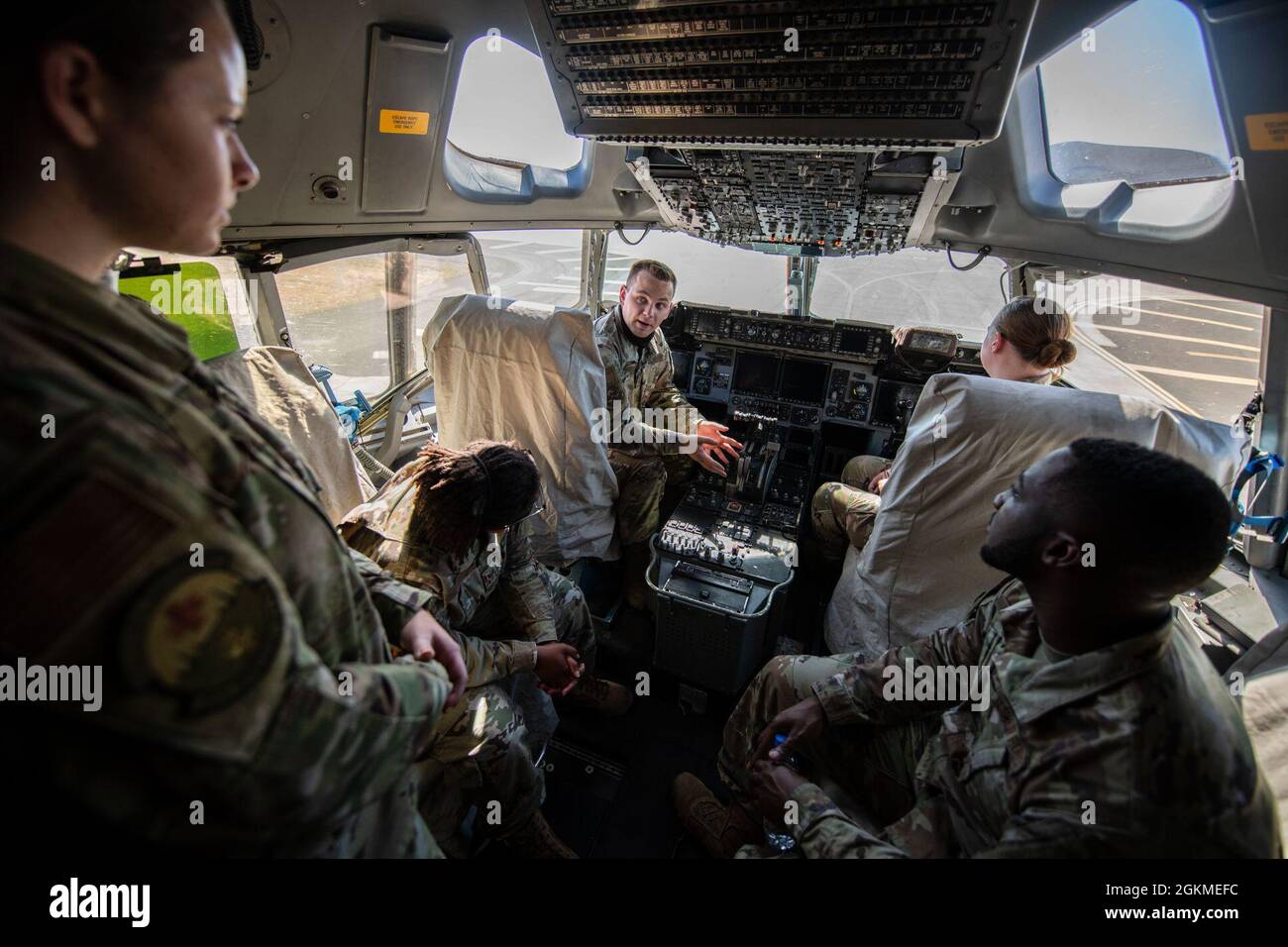 Senior Airman Zachery Kuhn, center, 860th Aircraft Maintenance Squadron ...