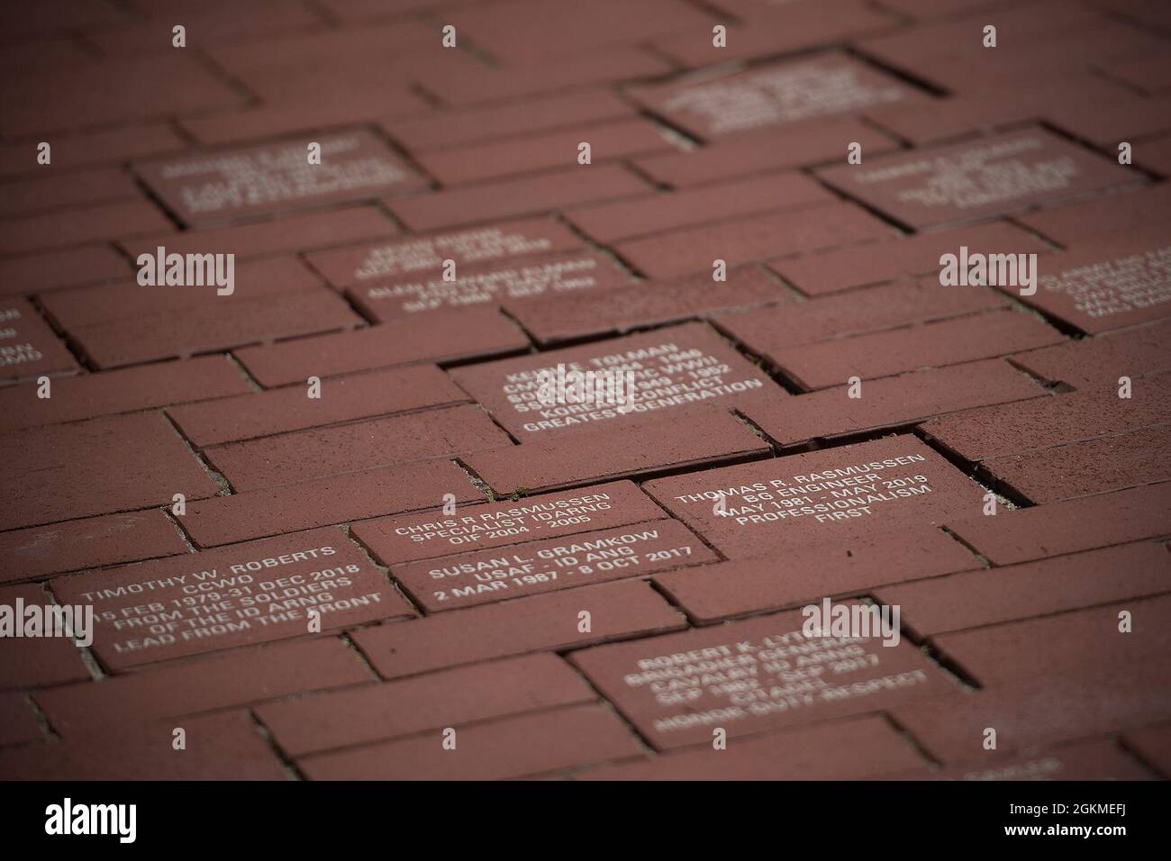 Memorial bricks line the inner circle near a fountain on the Gowen ...