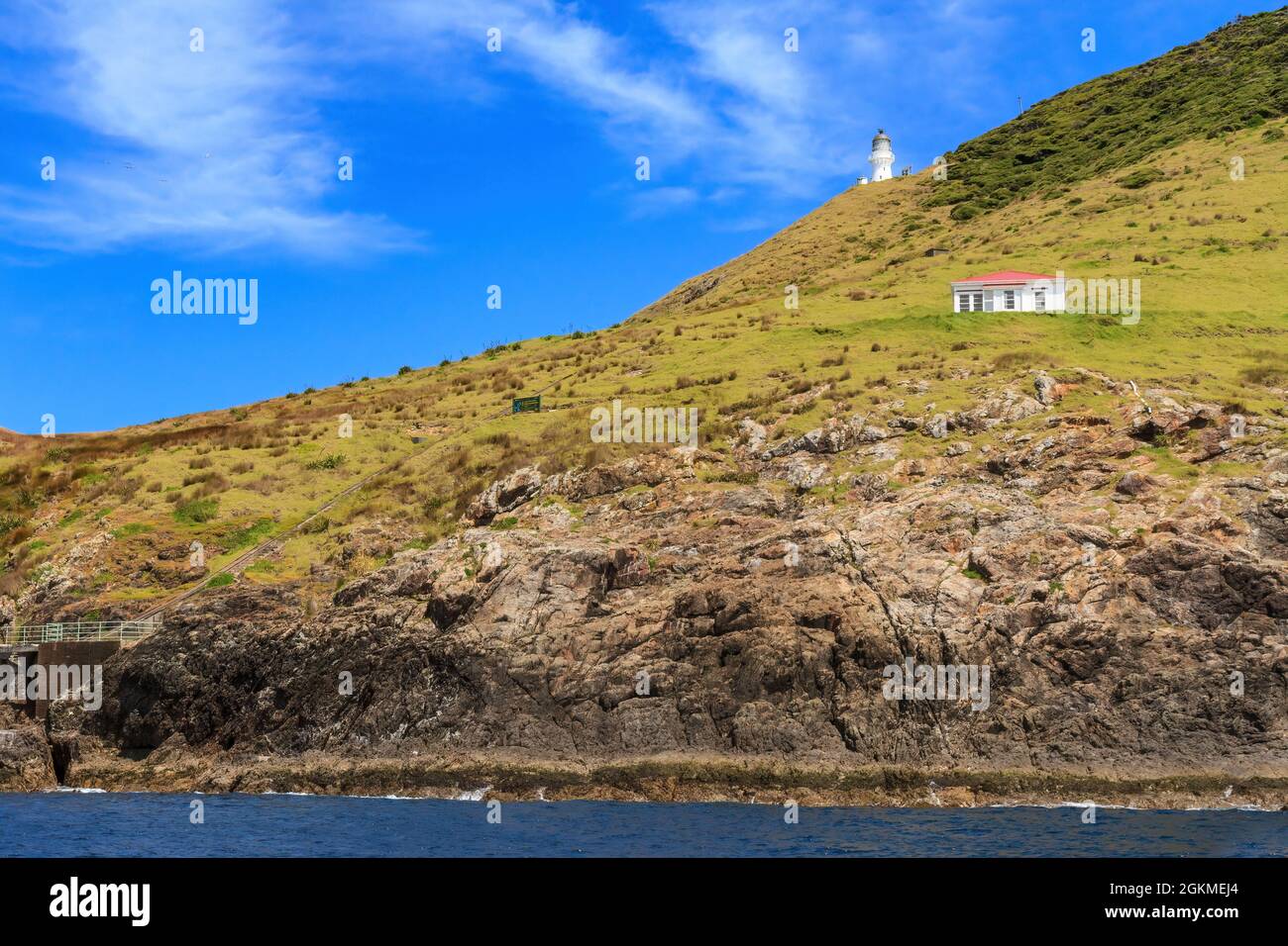 Cape Brett in the Bay of Islands, New Zealand. On the right is a ...