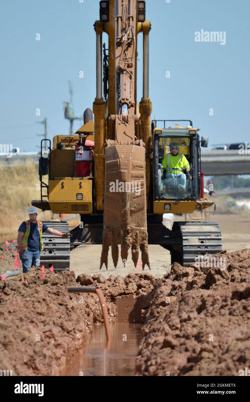 An excavator digs a 35-foot-deep trench along the top of the Reach H ...